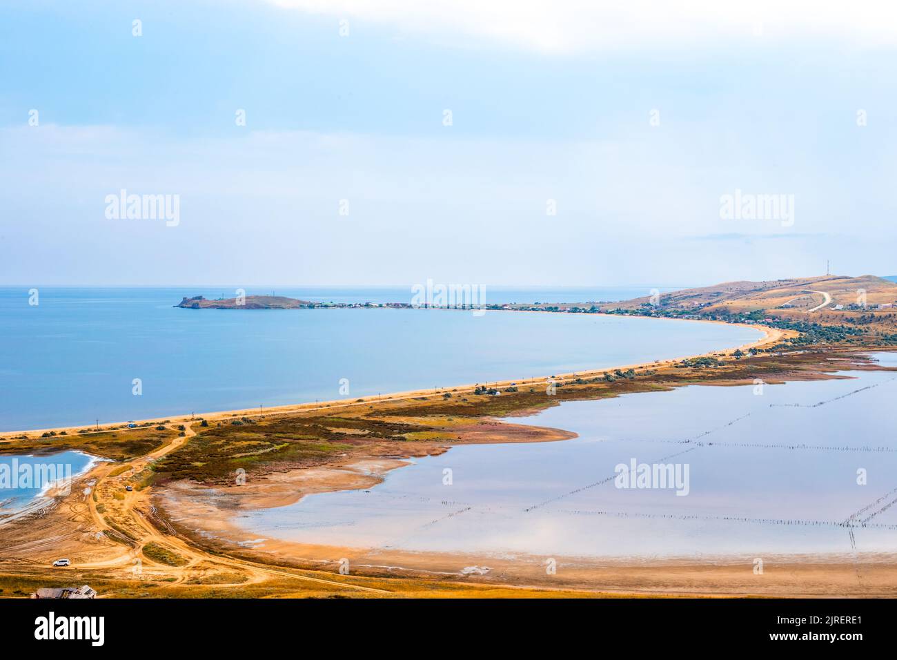 Sea with a strip of land and a lake on an autumn day, top view. Beauty ...
