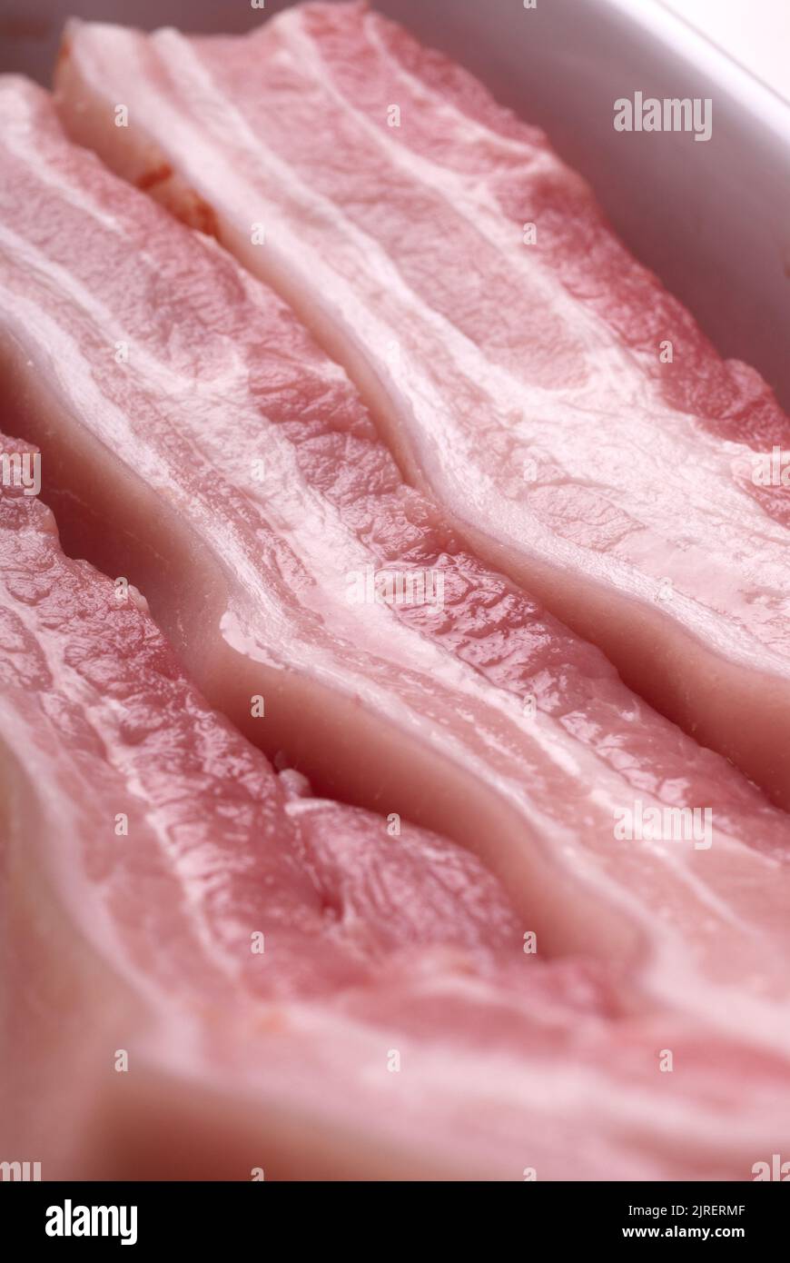 Close up of raw pork belly meat slices, full frame Stock Photo - Alamy