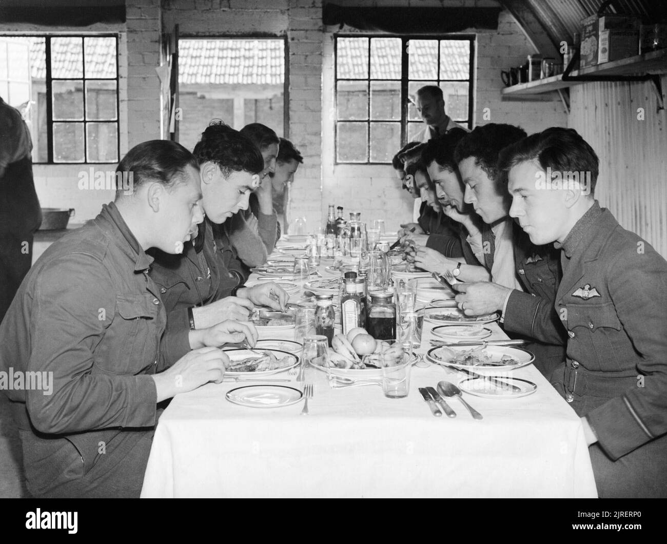 Pilots of No. 19 Squadron RAF eat lunch in the Officers' Mess at ...