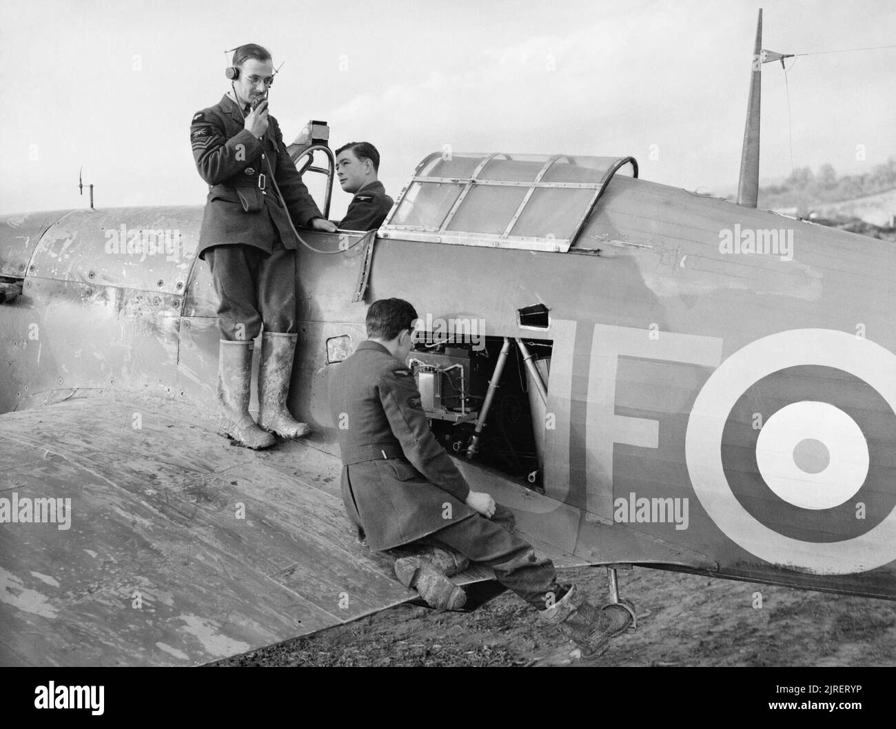 Radio mechanics testing the VHF transmitter/receiver in a Hawker ...