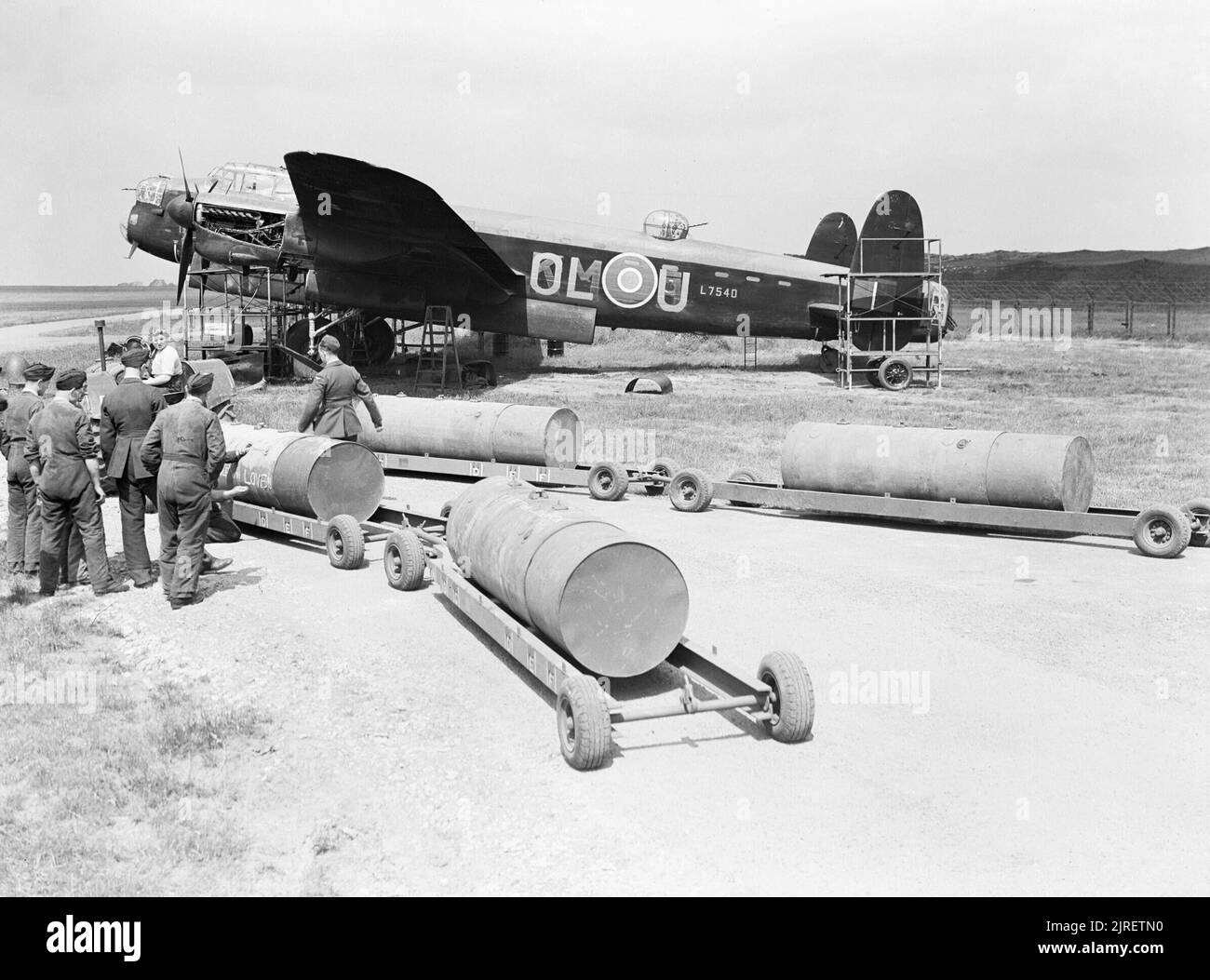 Royal Air Force Bomber Command, 1942-1945. A tractor-drawn train of 4,000-lb Mark I HC bombs ...