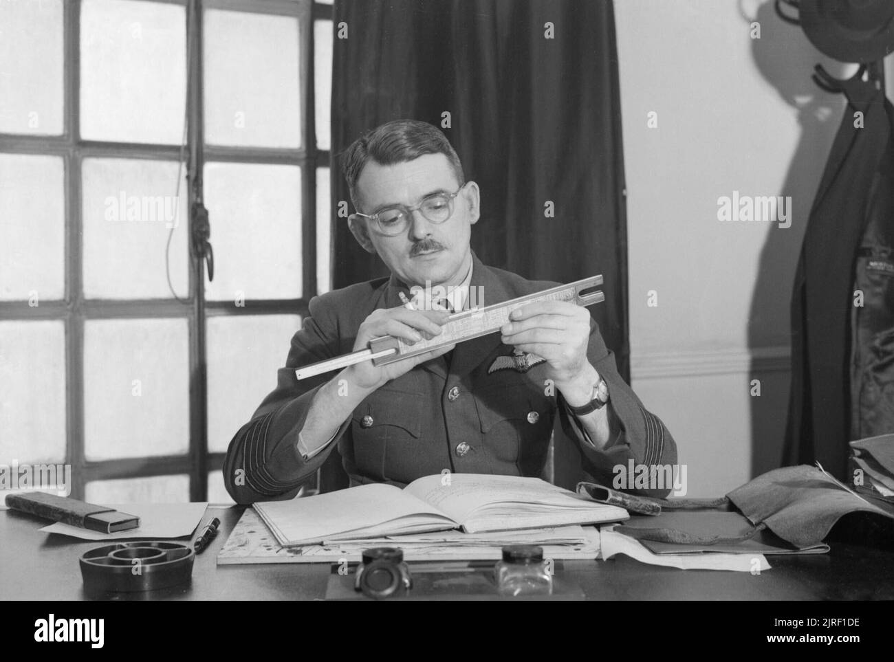 The Air Ministry, 1939-1945. Group Captain Frank Whittle adjusts a ...