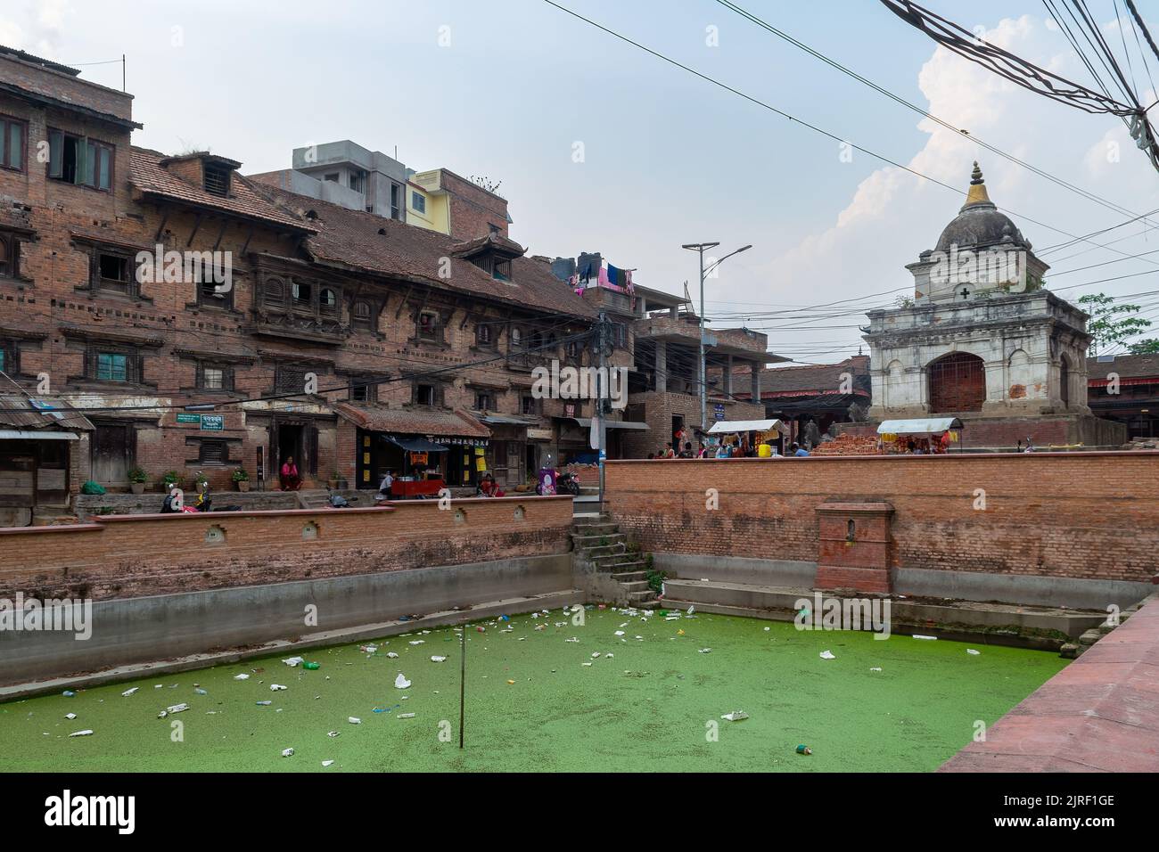 The historic De Pukhu building near green land in Kirtipur, Nepal Stock ...