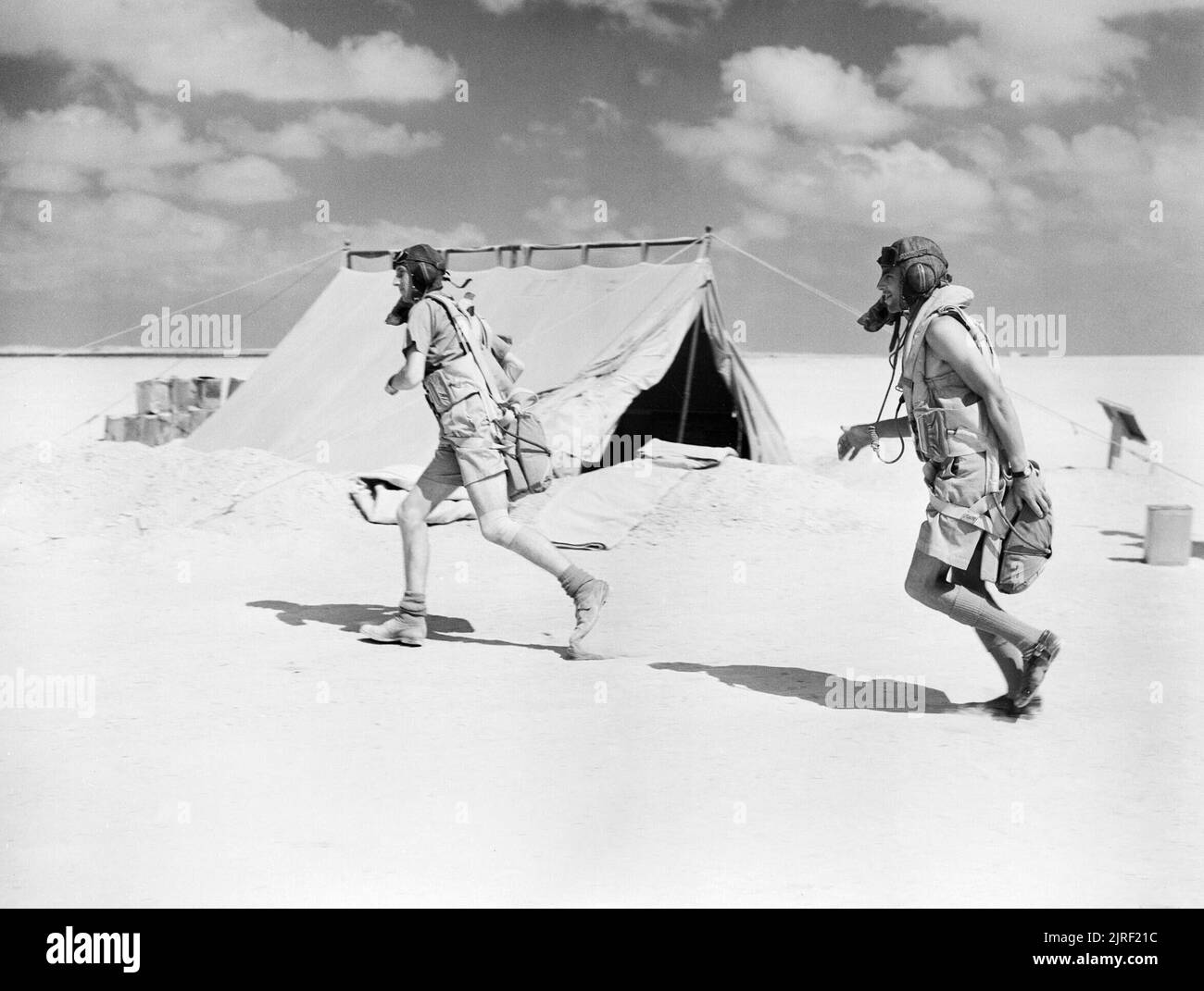 Two pilots of No. 274 Squadron sprinting to their aircraft during a ...