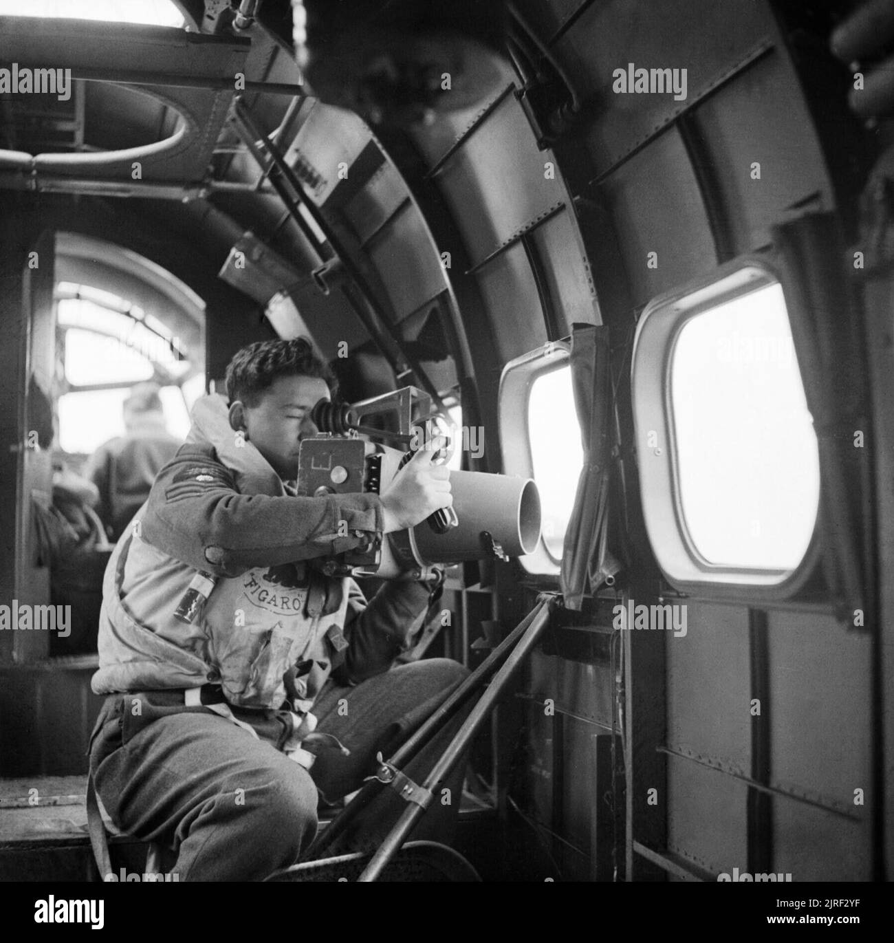 A crewman on board an RAF Coastal Command Lockheed Hudson of No. 269 ...