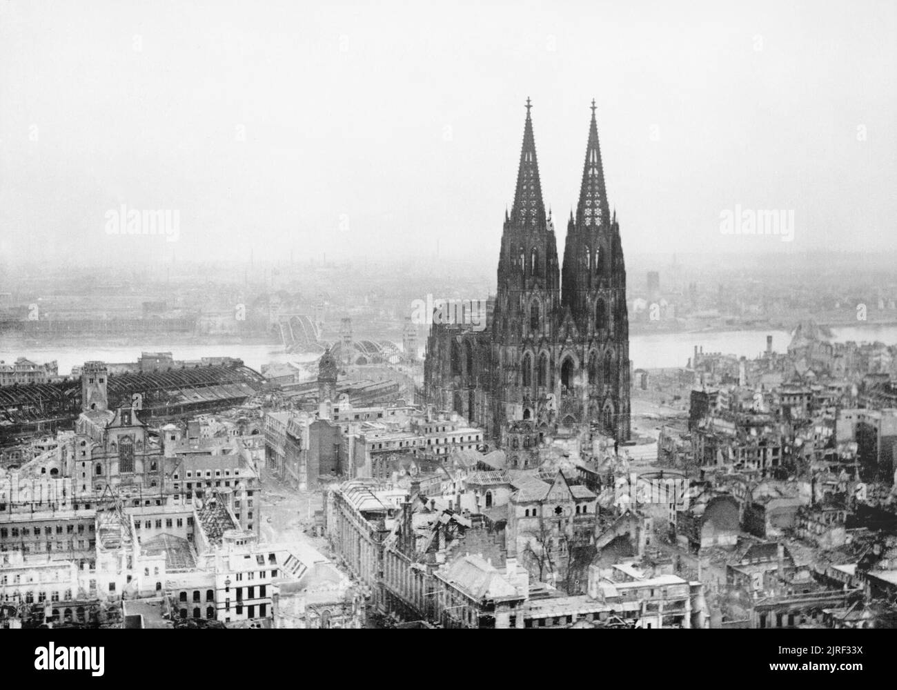 Cologne Cathedral stands intact amidst the destruction caused by Allied ...