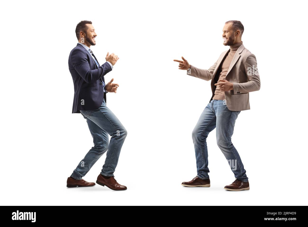 Full length profile shot of two young professional men dancing isolated ...