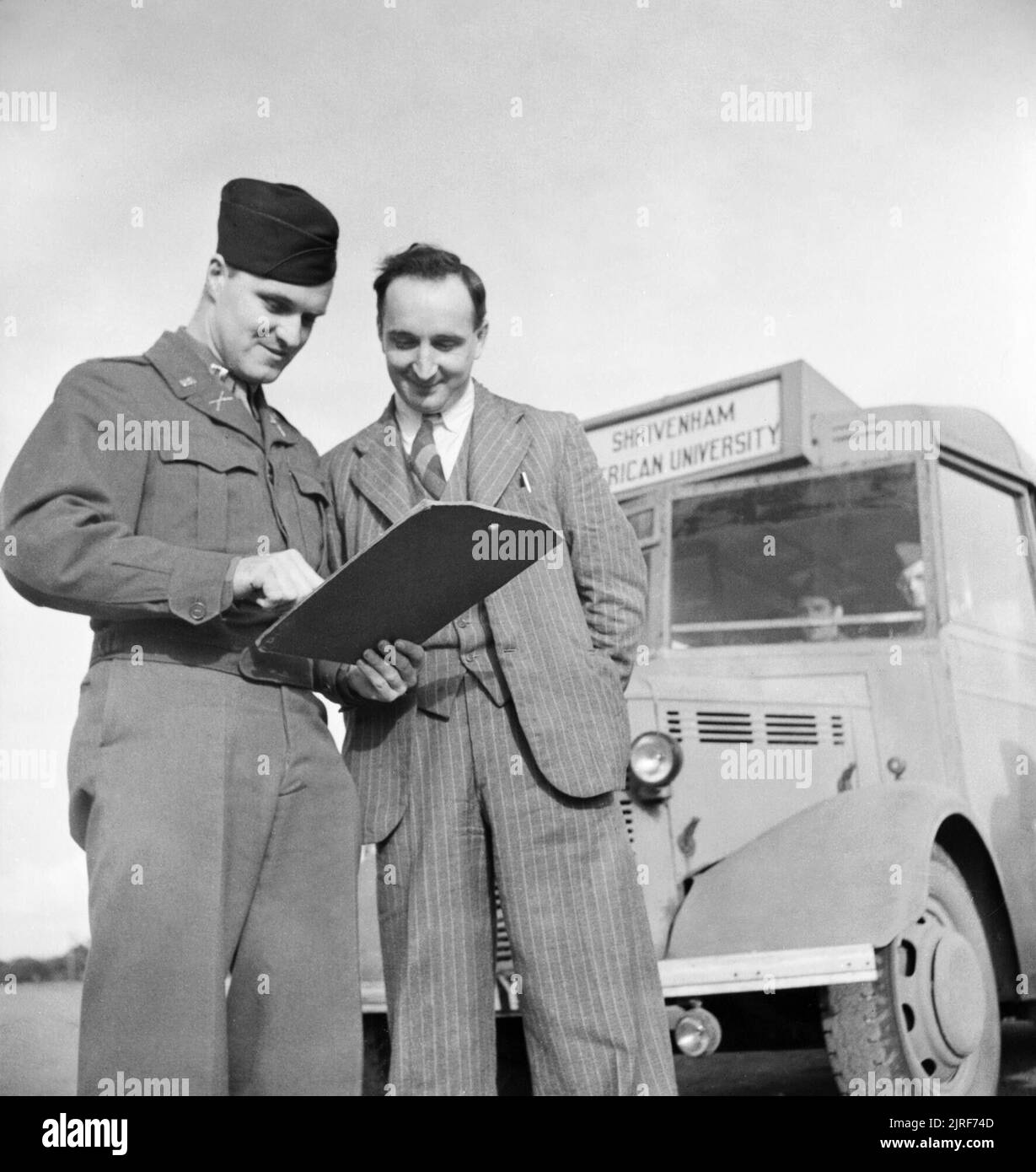 Corporal Thomas Gibson checks a schedule with British driver Gwyn ...
