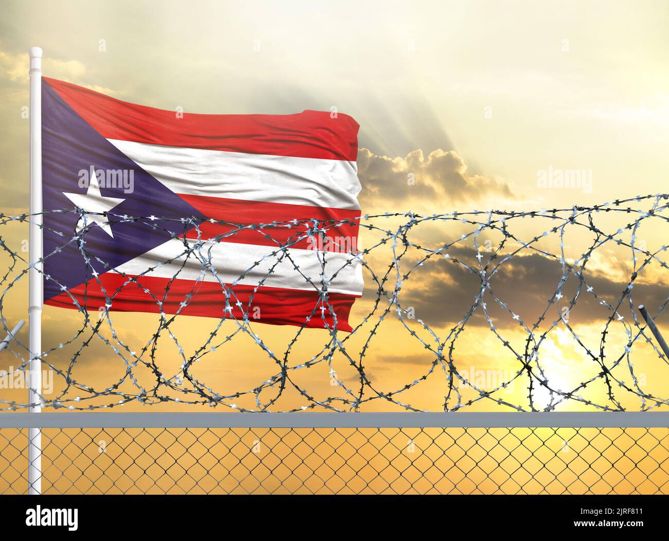 Flagpole with the flag of Puerto Rico against the sky and behind a ...