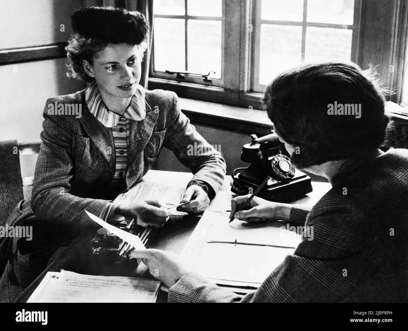 Iris Joyce talks with a recruiting officer as she enrols in the Women's ...