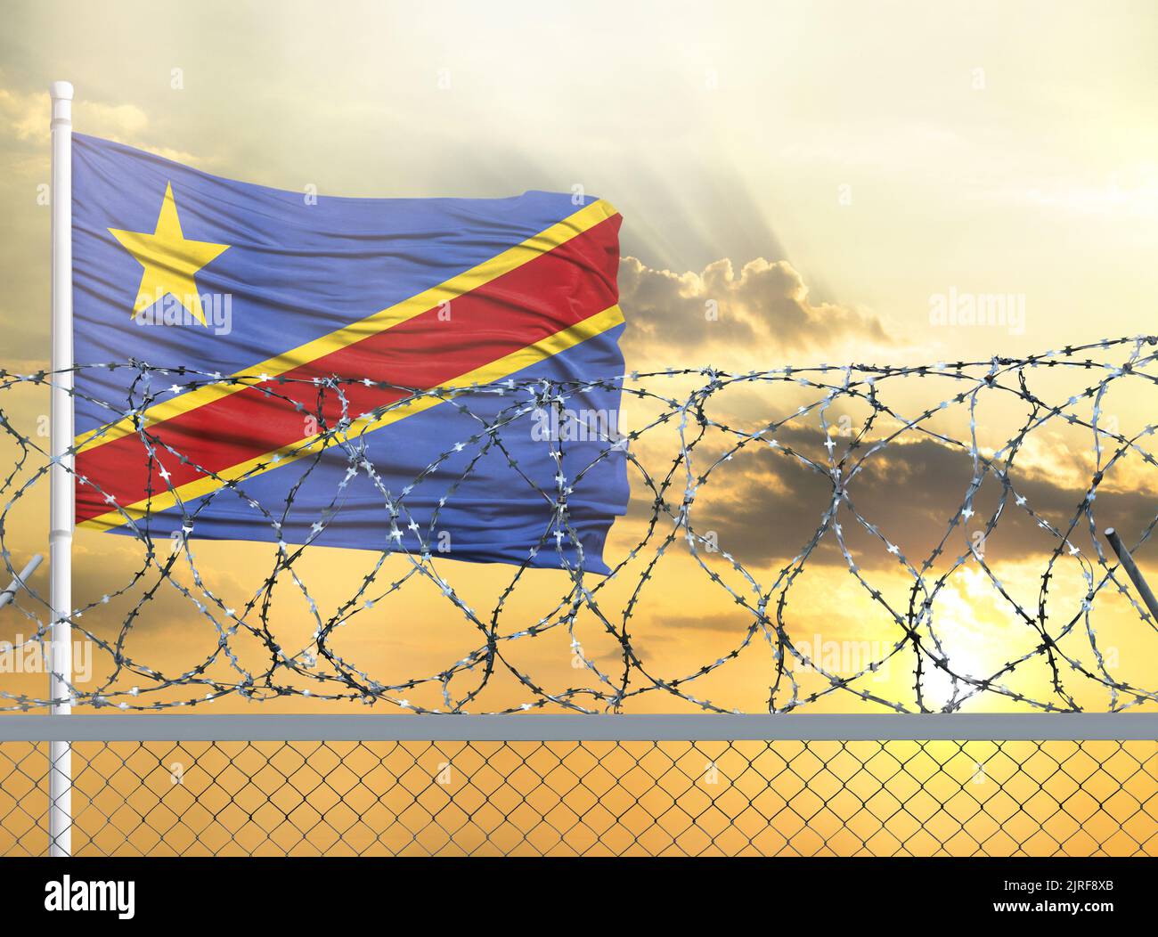 Flagpole with the flag of Congo Democratic against the sky and behind a ...