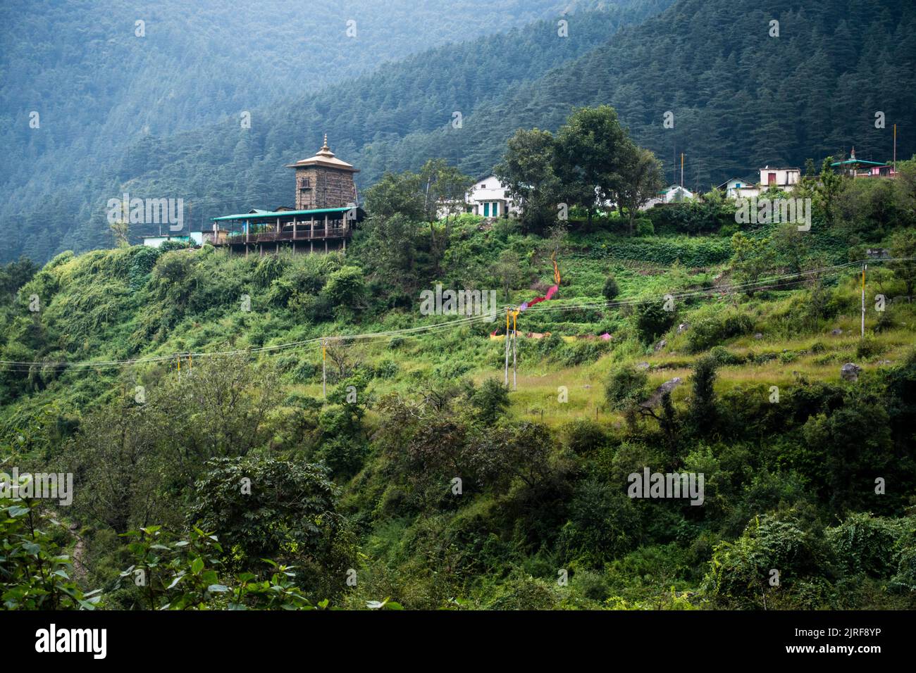Uttarakhand India. A small ancient temple on a hill top surround with ...