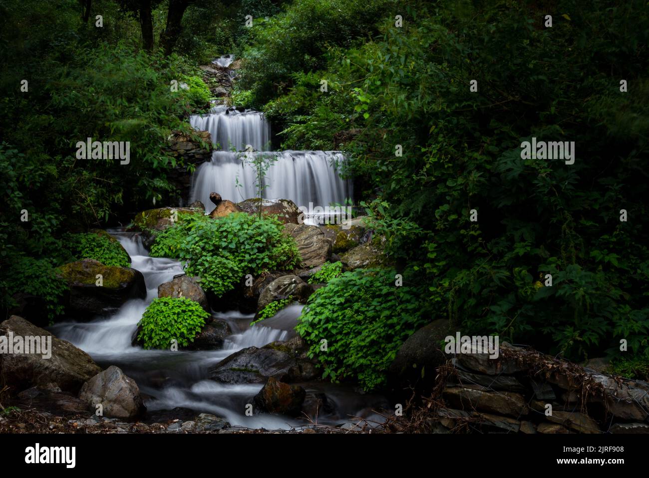 Long exposure shot with silky water fall , river flowing through the ...