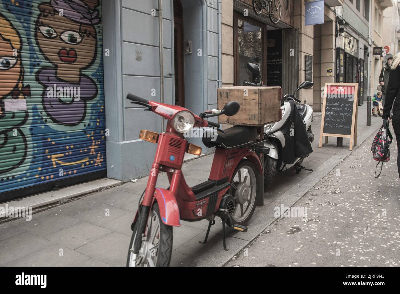 A red Vespino moped parked in the street Stock Photo - Alamy