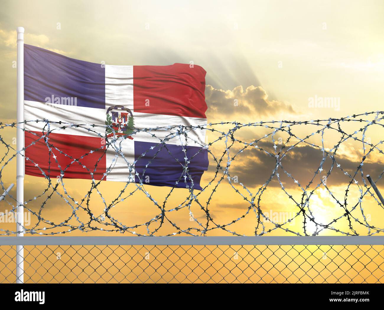 Flagpole with the flag of Dominican Republic against the sky and behind ...