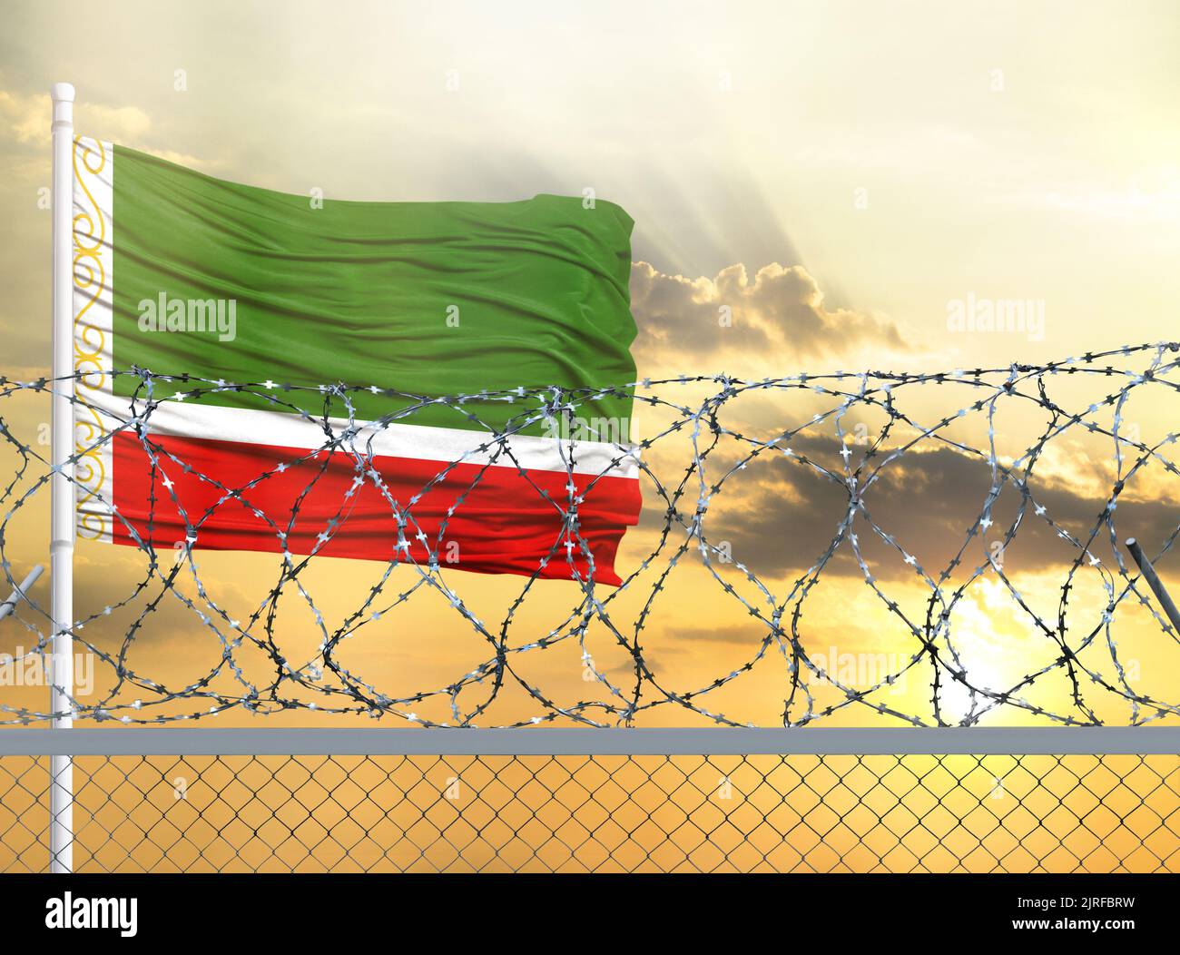 Flagpole with the flag of Chechen Republic against the sky and behind a ...