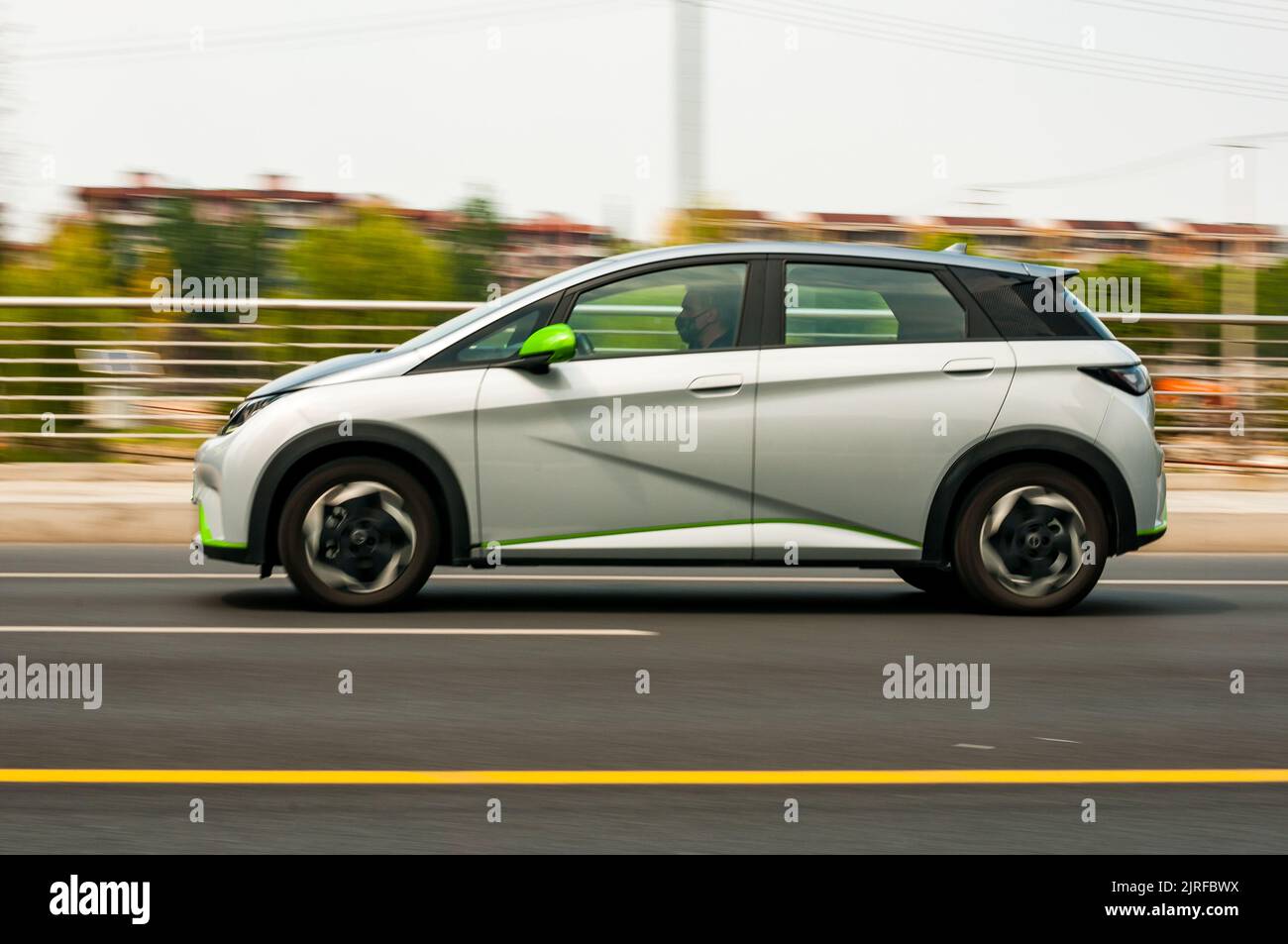 BYD Dolphin small electric hatchback car being driven on the road in ...