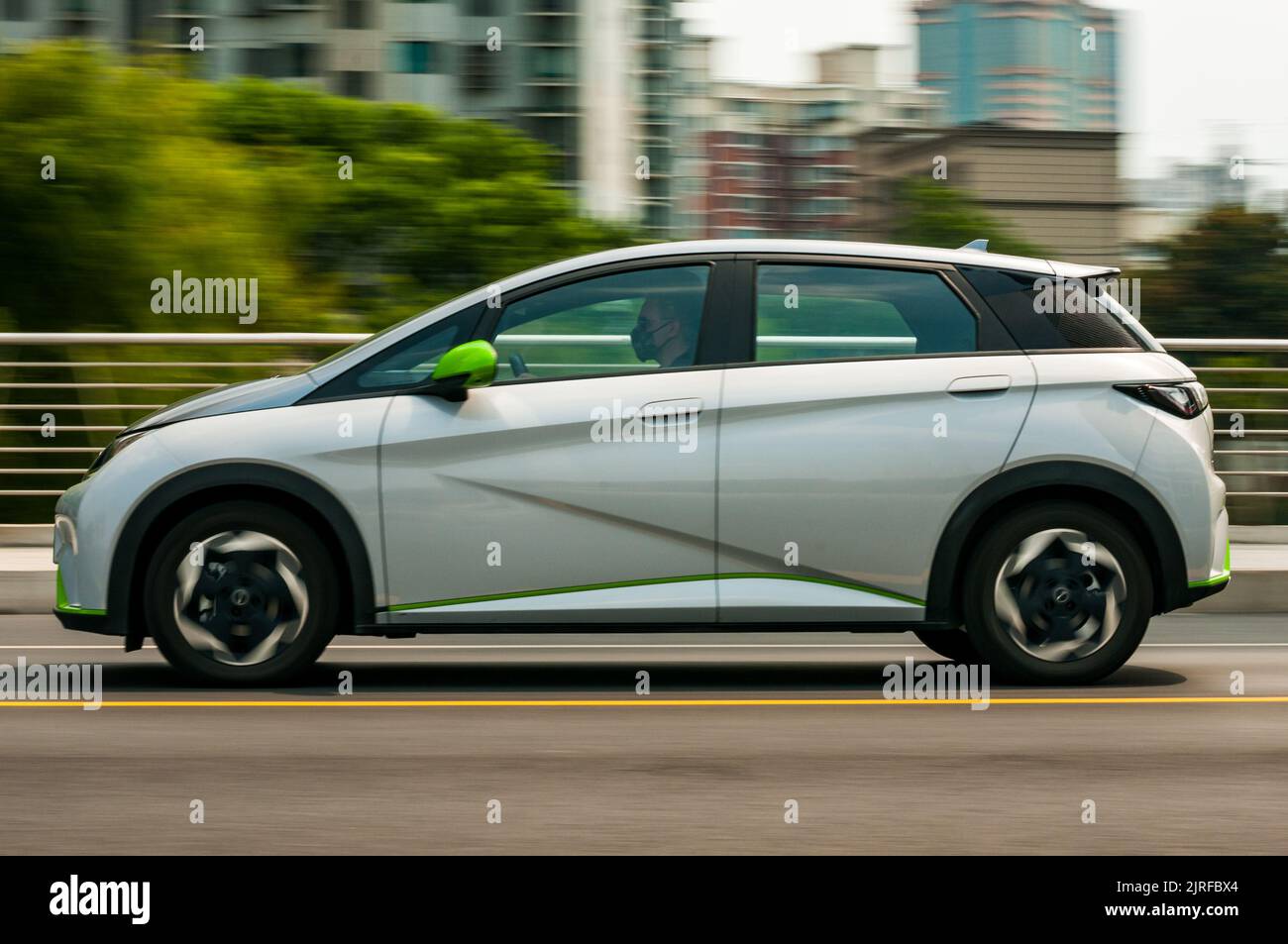 BYD Dolphin small electric hatchback car being driven on the road in ...