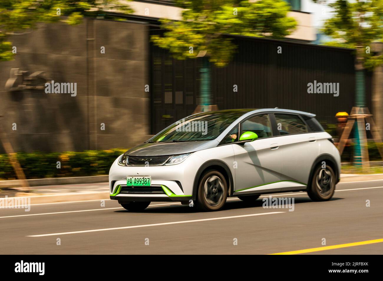 BYD Dolphin small electric hatchback car being driven on the road in ...