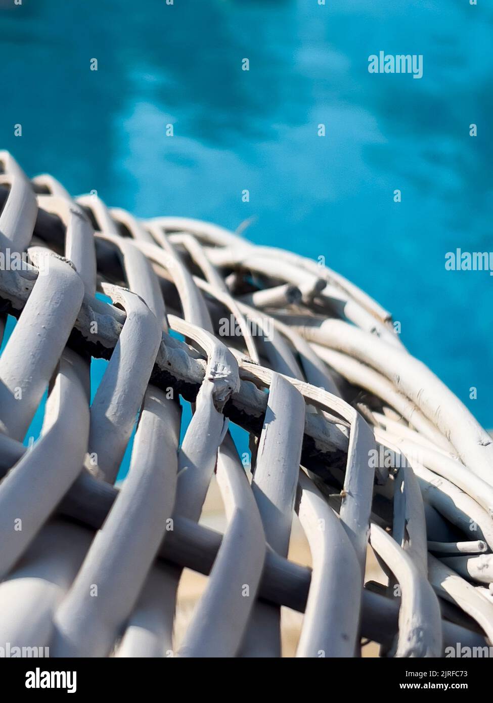 Group of whitewashed bamboo parasol in a row. Close up on natural ...