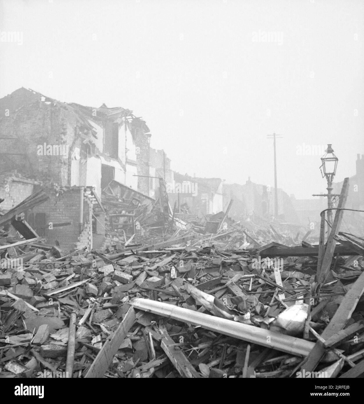 Bomb Damage in Birmingham, England, 1940 A pile of rubble and timber ...