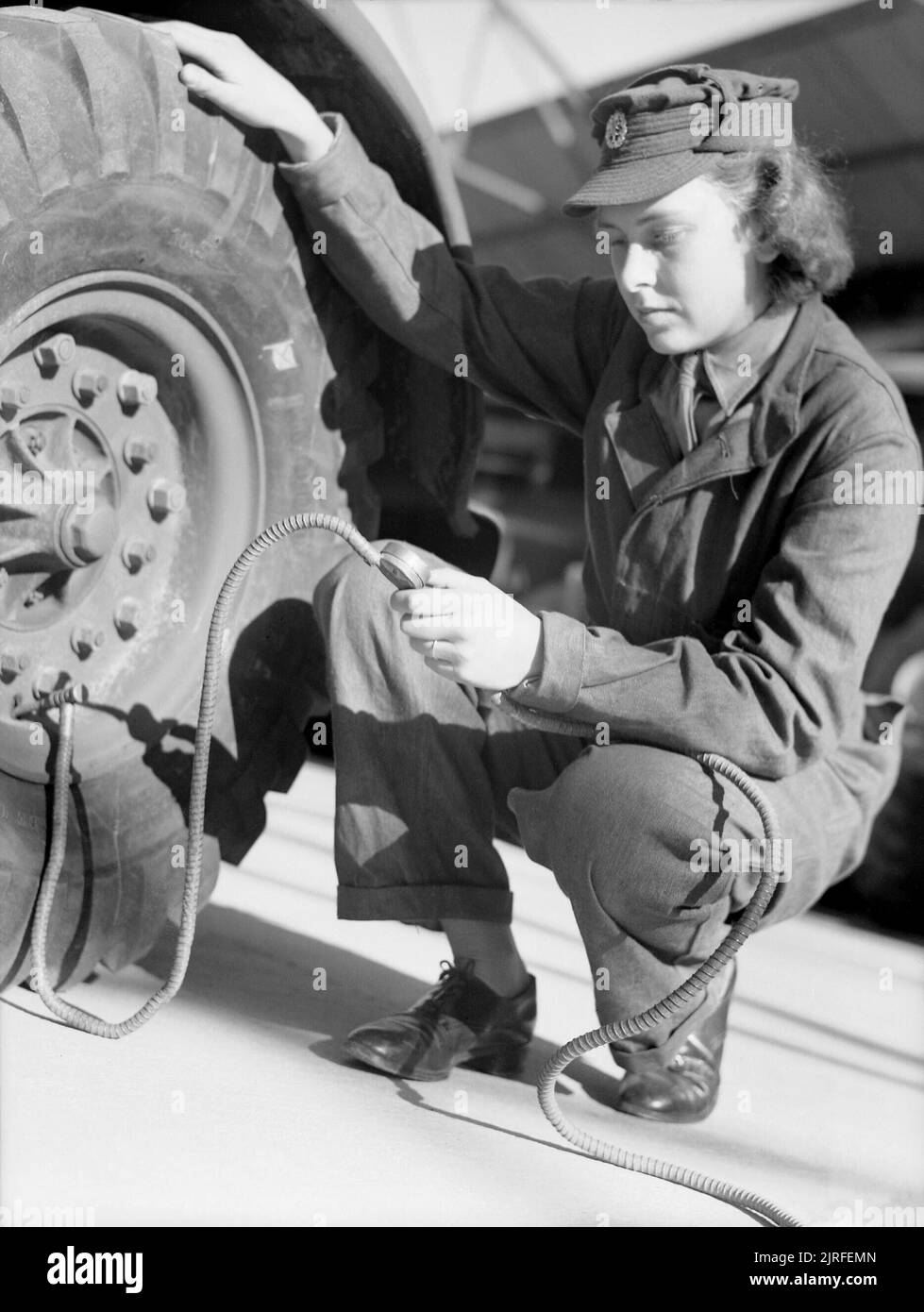 A member of the Auxiliary Territorial Service (ATS) tests the air ...