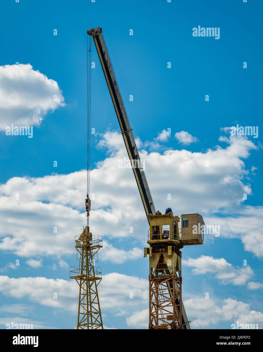 Tower crane assembly. Installation of a construction crane before ...