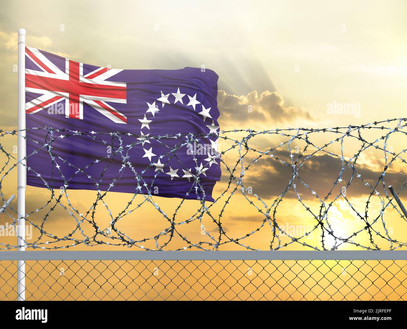 Flagpole with the flag of Cook Islands against the sky and behind a ...