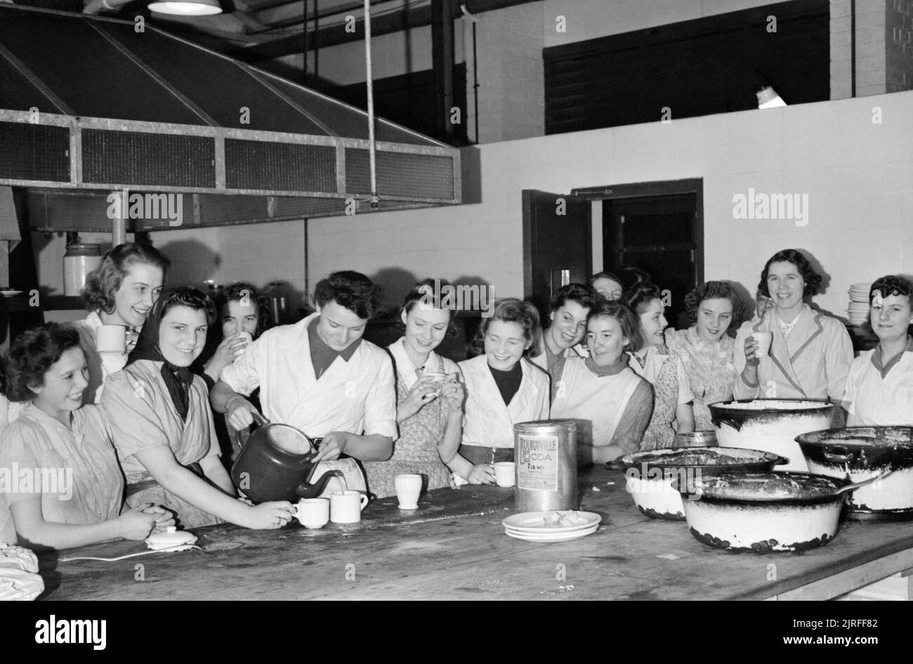 Catering staff have a quick cup of tea before the dinner-time rush ...