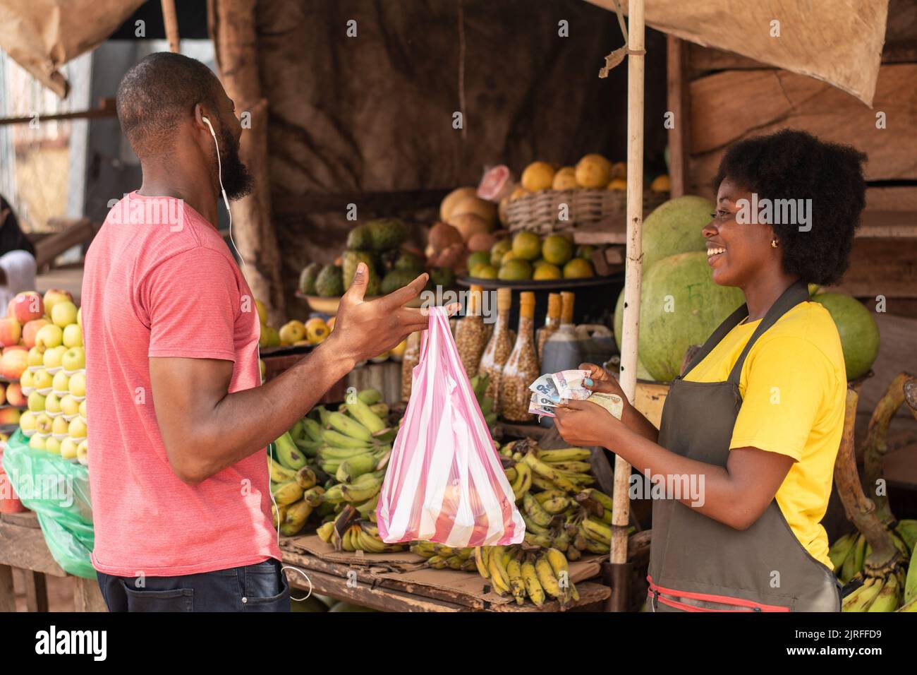 african woman selling in a market counting money Stock Photo - Alamy