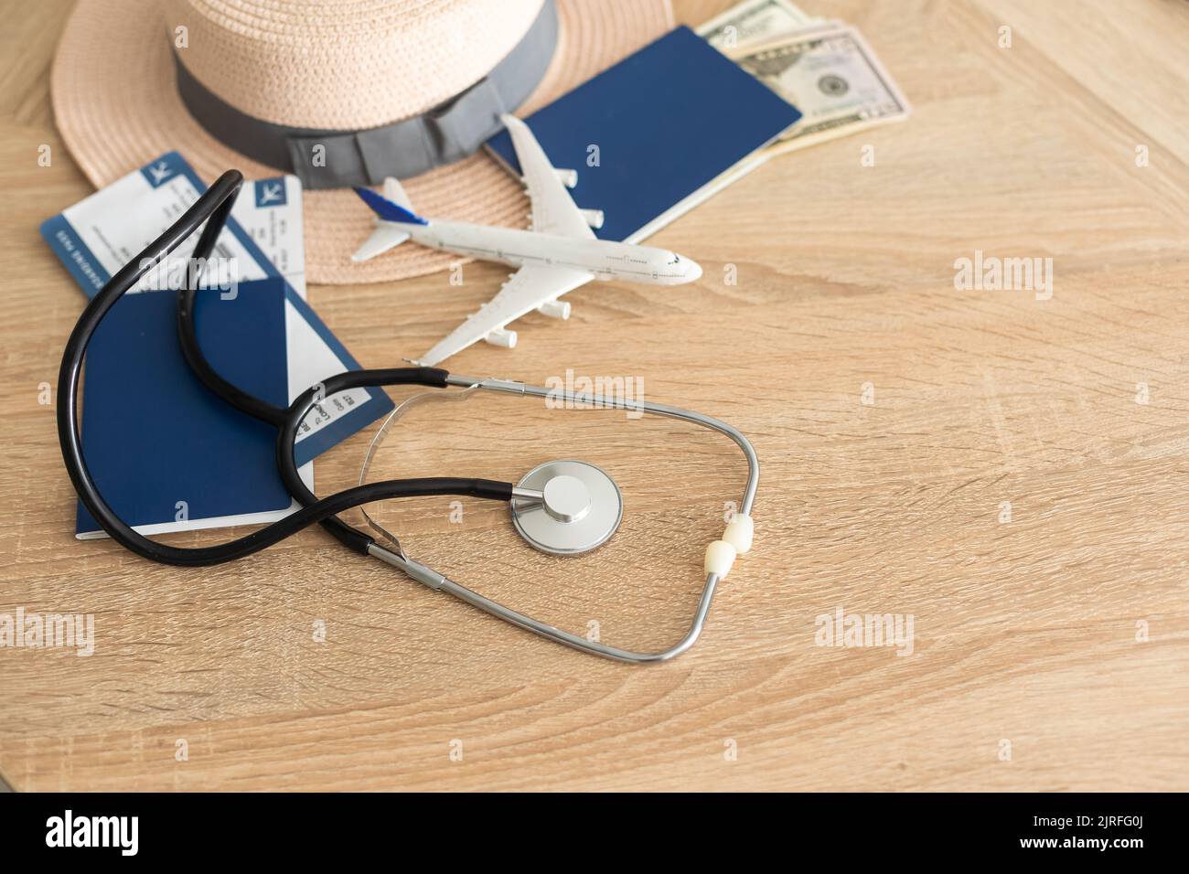 Travel and healthcare concept. Top view of passport, stethoscope and ...