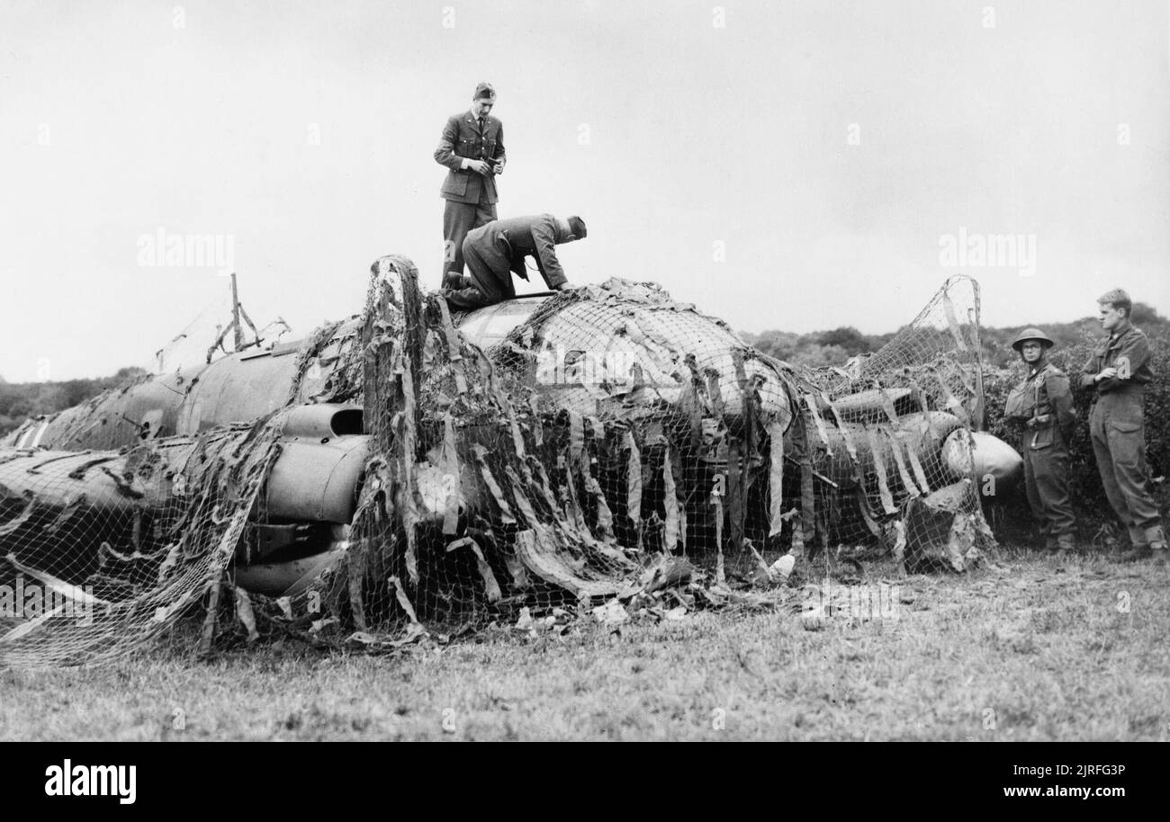 The Battle of Britain RAF personnel inspecting Heinkel He 111P (coded ...