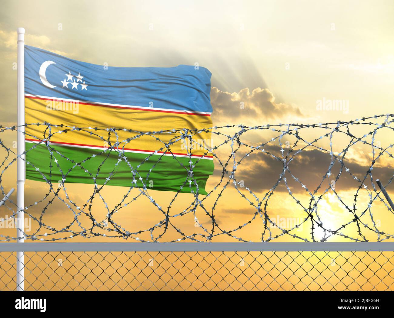 Flagpole with the flag of Karakalpakstan against the sky and behind a ...