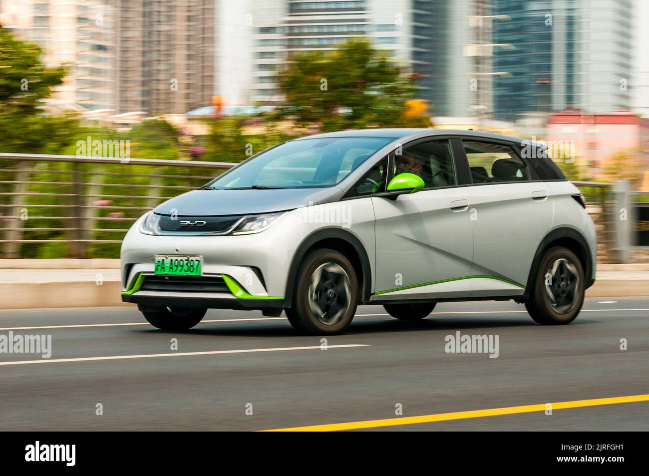 BYD Dolphin small electric hatchback car being driven on the road in ...