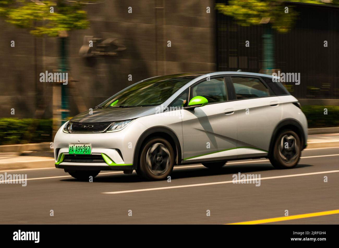 BYD Dolphin small electric hatchback car being driven on the road in ...