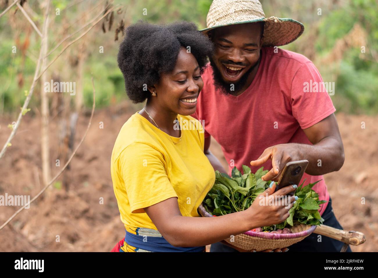 excited african farmers checking a phone see exciting news Stock Photo ...
