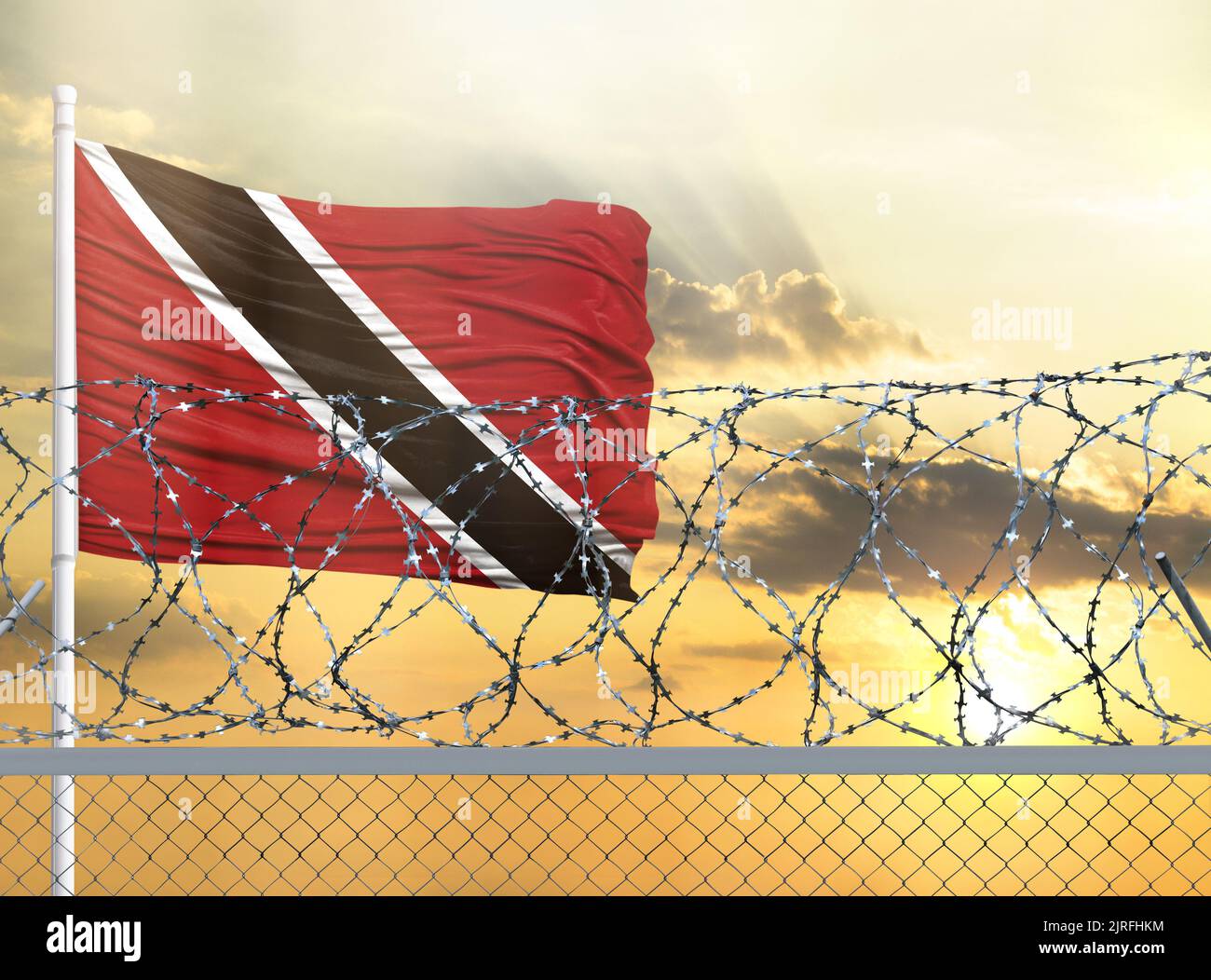 Flagpole with the flag of Trinidad and Tobago against the sky and ...