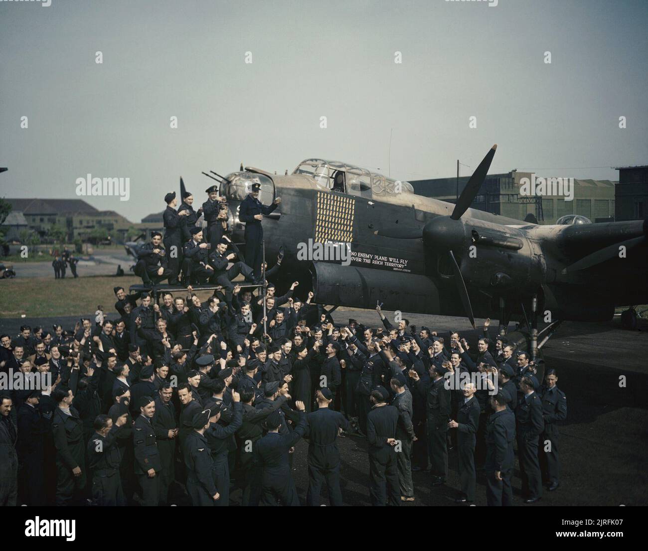 Aircrew and ground staff of No. 467 Squadron, RAAF, celebrate the ...