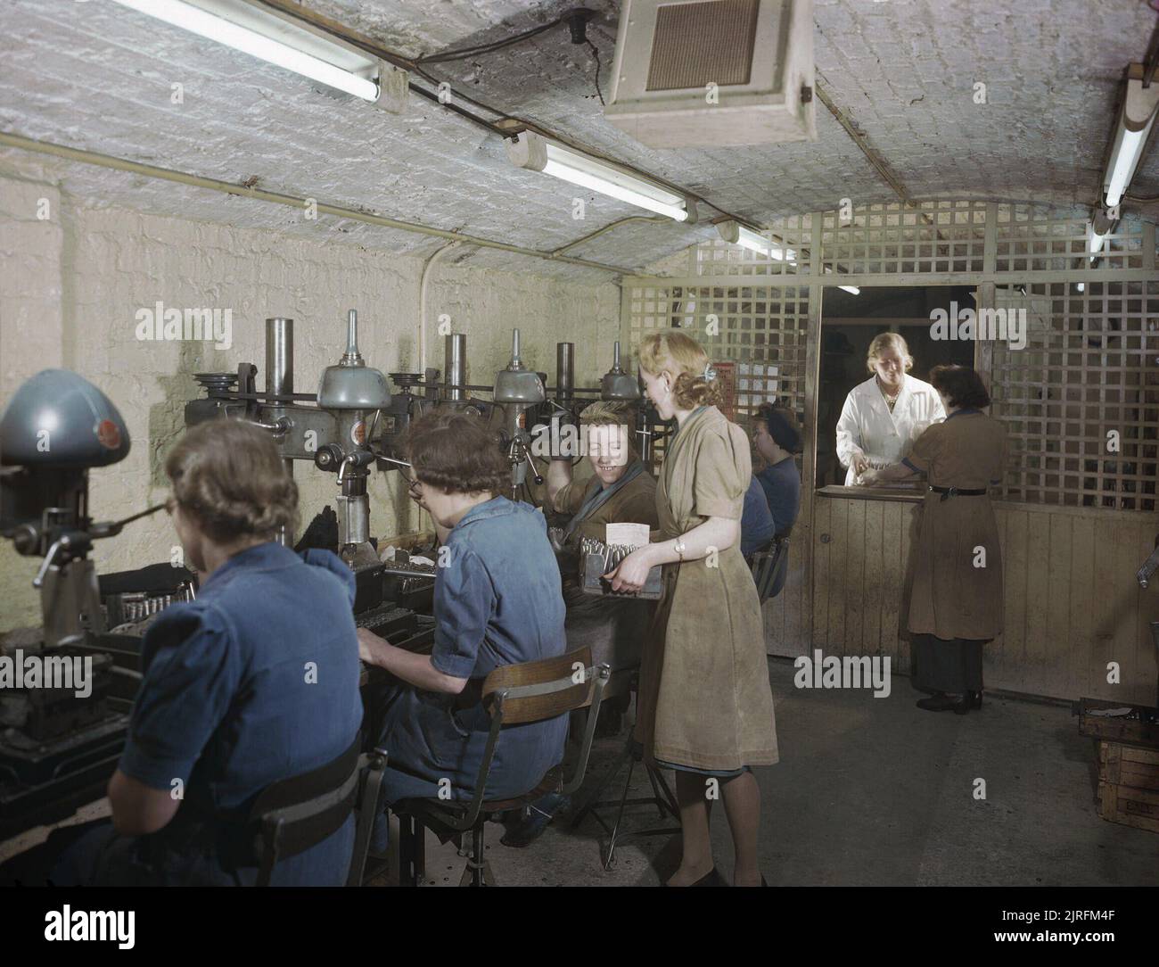 Women working in an underground munitions factory at Liverpool, 1945 ...