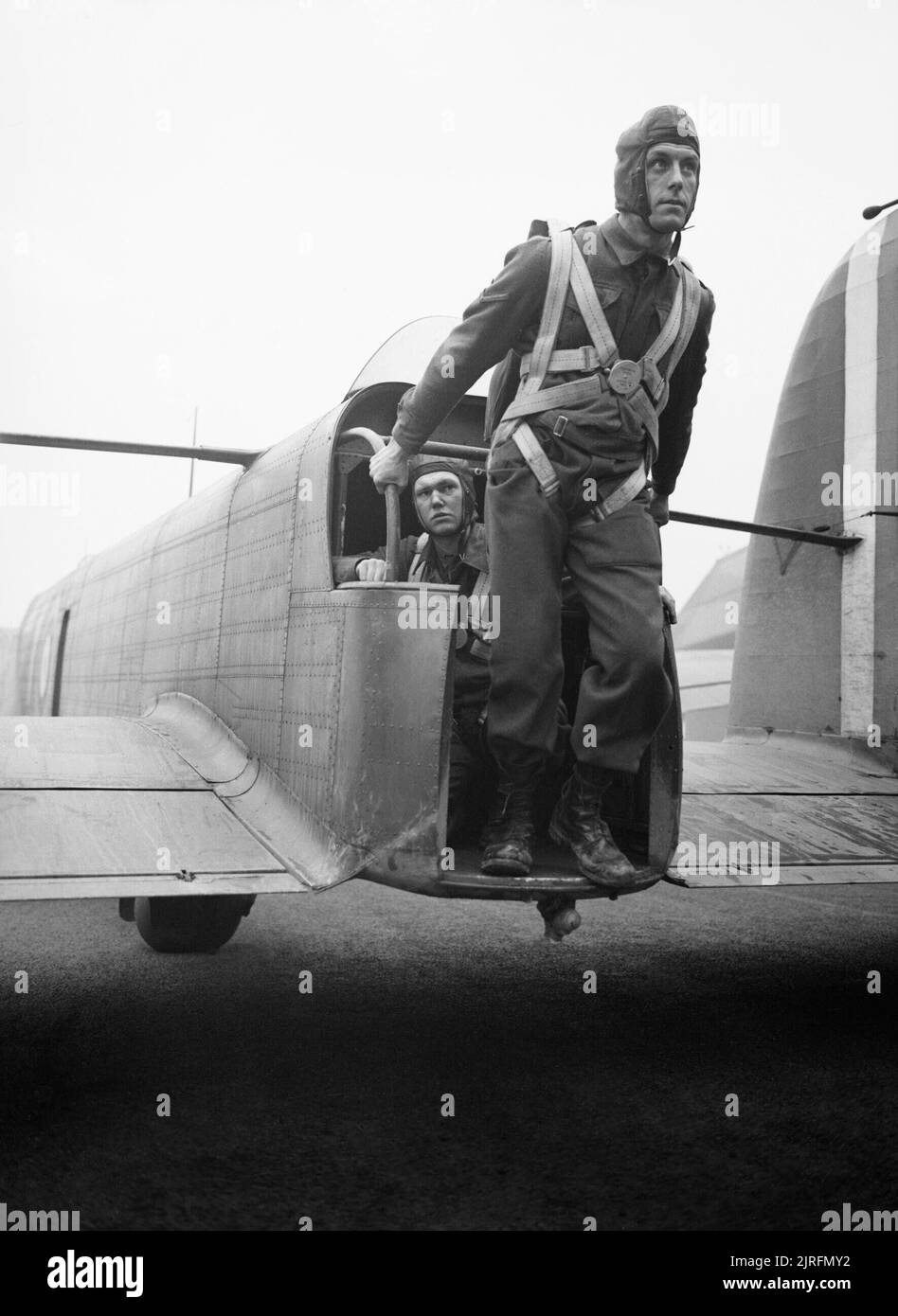 A parachute soldier demonstrates the exit point from the tail of a ...