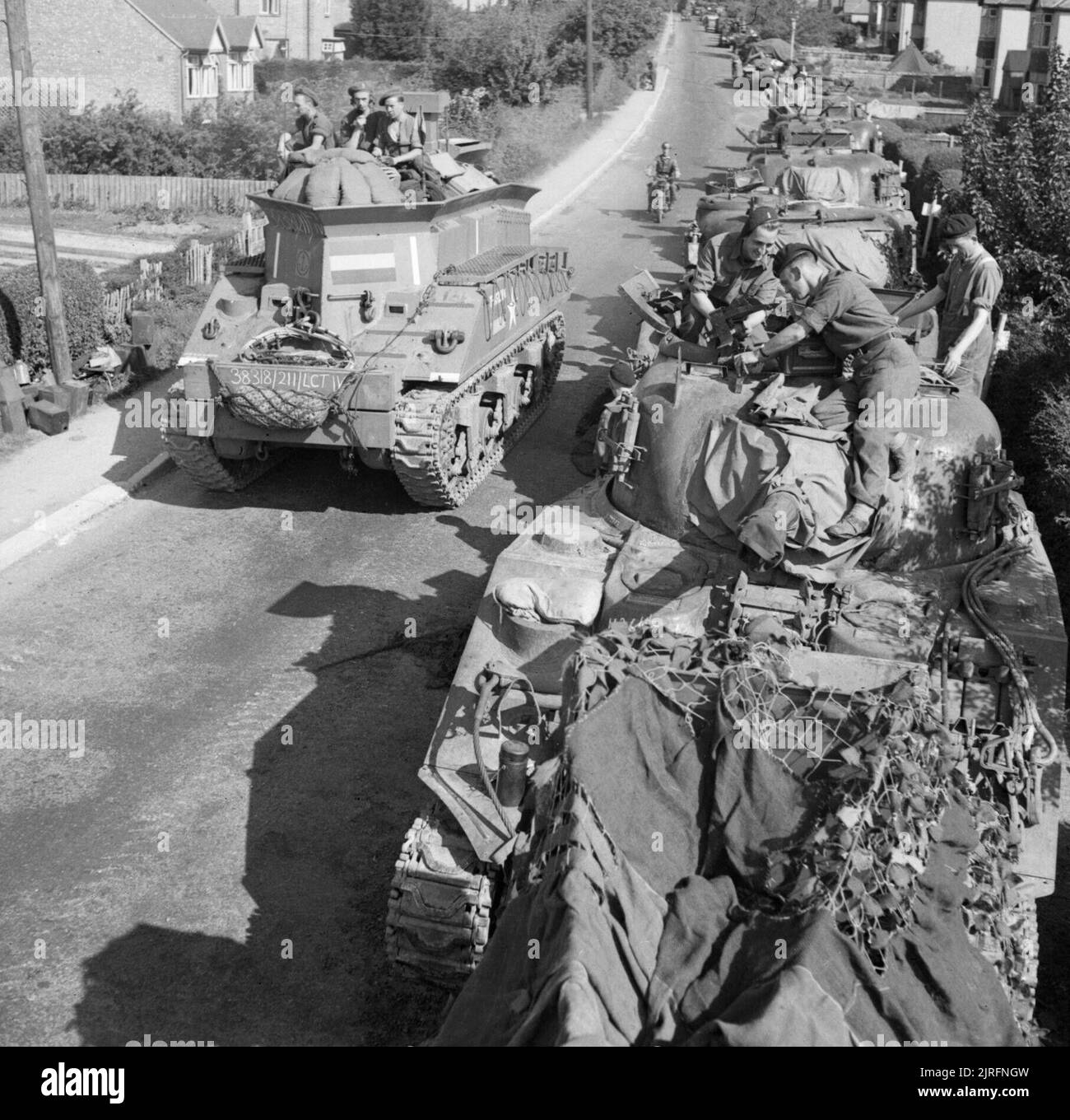 A Sherman BARV (Beach Armoured Recovery Vehicle) and Sherman tanks of ...
