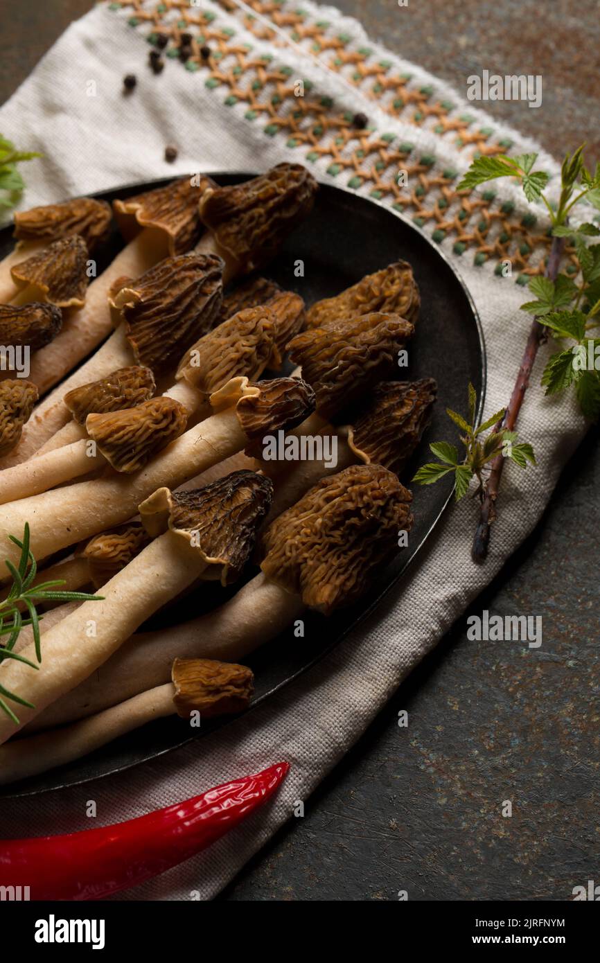 Morel forest mushrooms with spicy spices and aromatic vegetables Stock ...