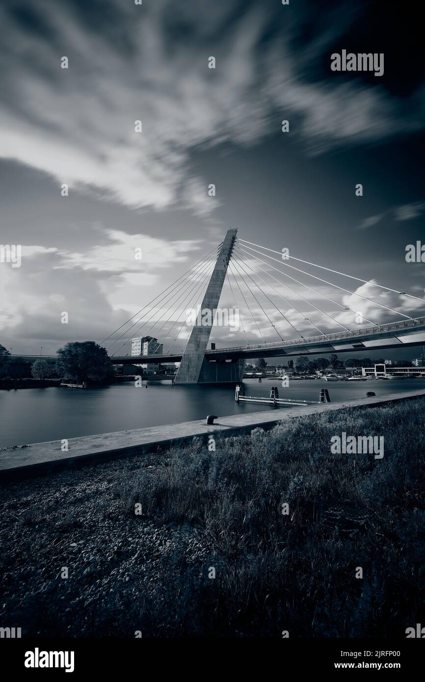 A vertical shot of the Lekki - Ikoyi Link Bridge over a river in ...