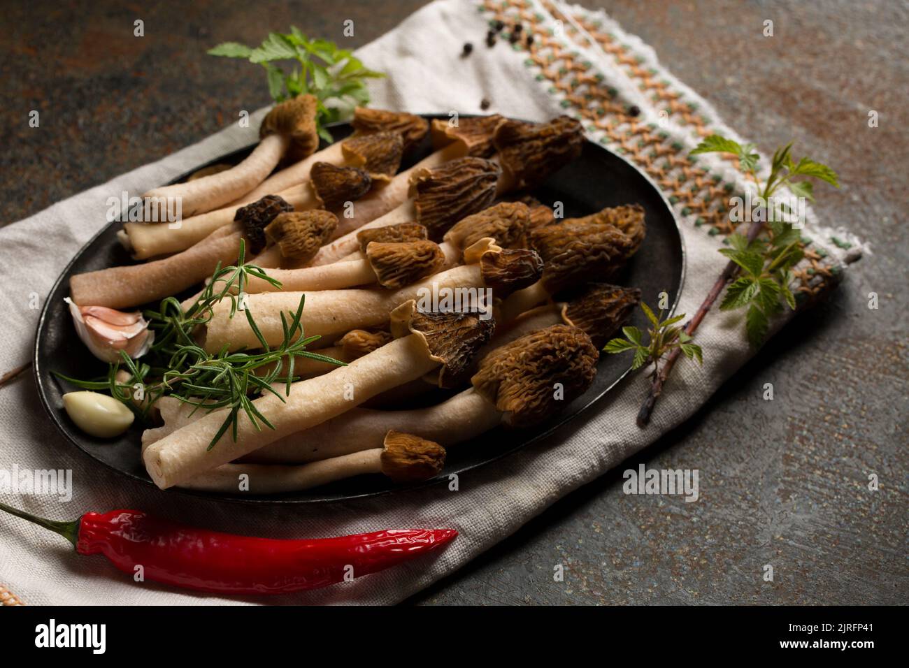 Morel forest mushrooms with spicy spices and aromatic vegetables Stock ...