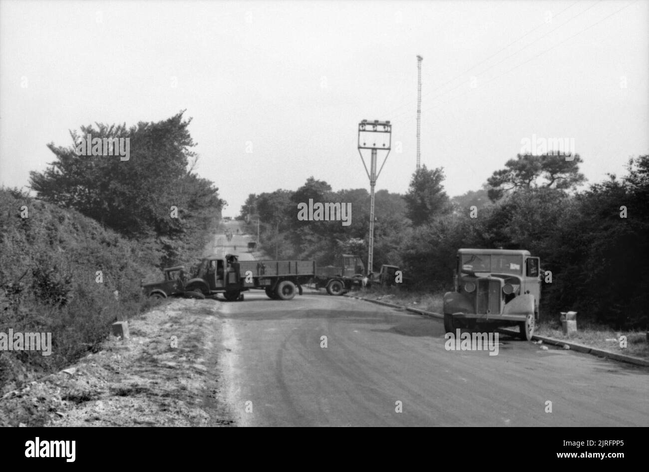 The British Army in France 1940 Abandoned lorries used as roadblocks on ...