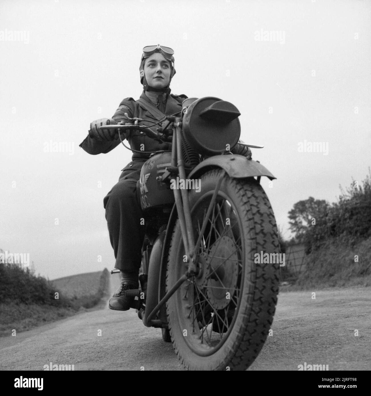 An Auxiliary Territorial Service (ATS) motorcycle despatch rider in ...