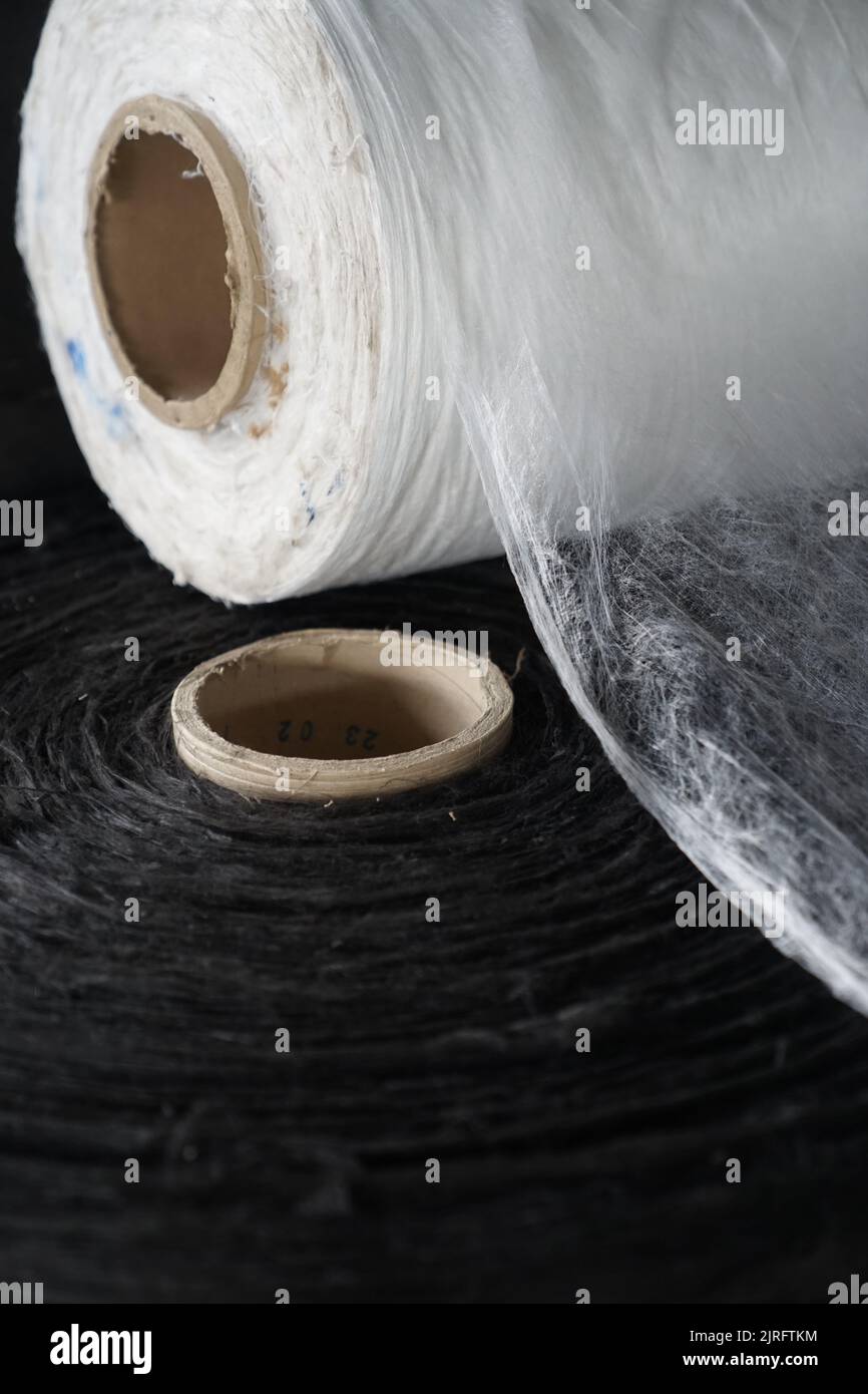 A vertical closeup of black and white cotton rolls Stock Photo - Alamy