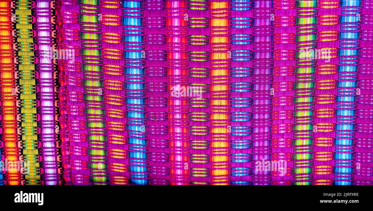 The fabric of many colors made with handmade vertical and horizontal ...