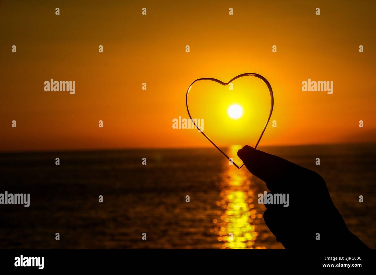 Love Concept Heart and Sun Setting on the Atlantic Ocean Stock Photo ...