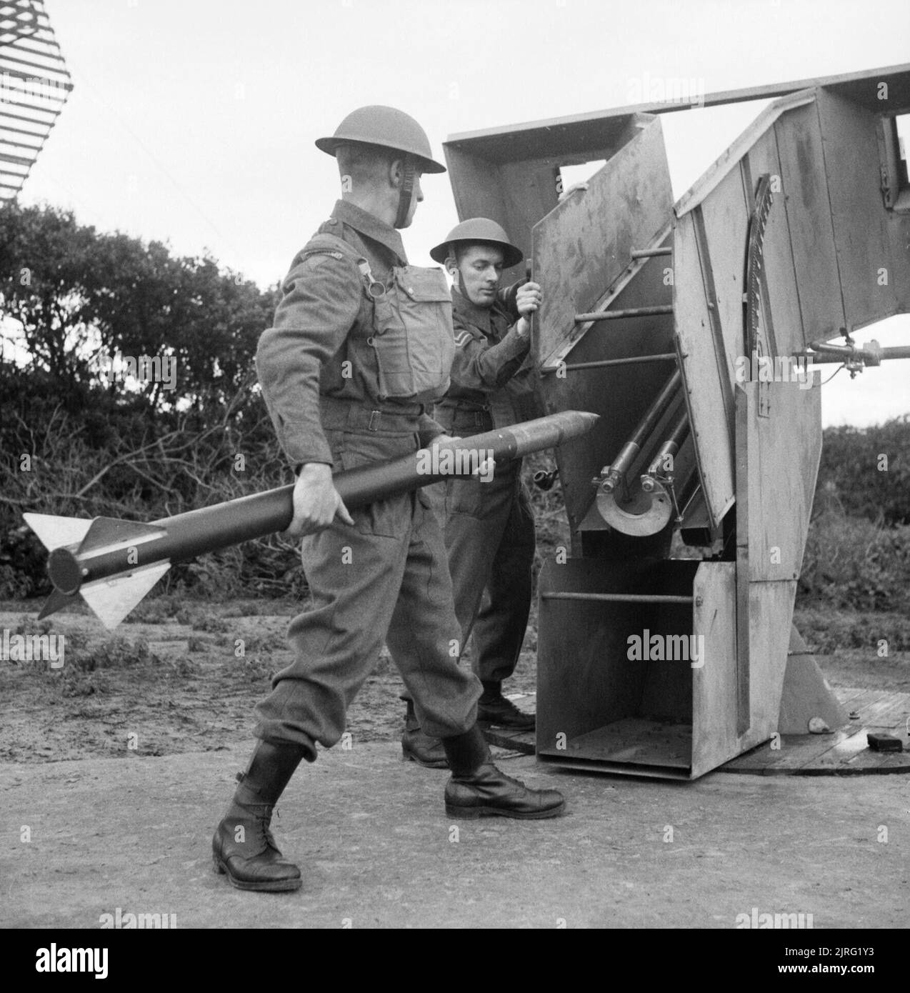 The Home Guard 1939-45 Home Guard soldiers load an anti-aircraft rocket ...